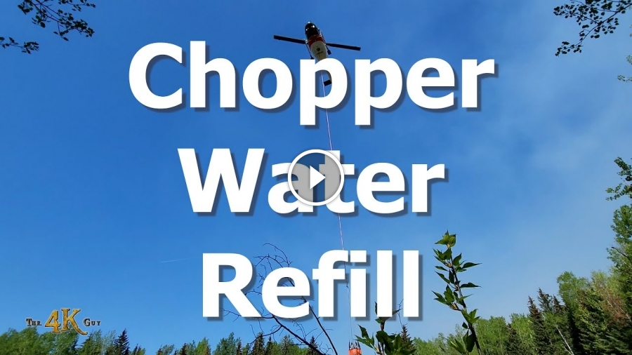 Shining Bank: Closeup of helicopter refilling bucket from small lake 5 ...